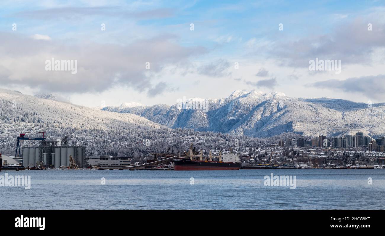 Rocky Mountains and buildings, North Vancouver BC, Canada. View with ...