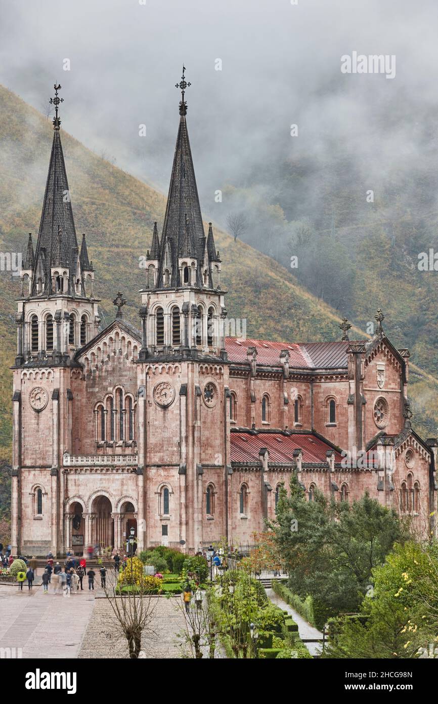 Picturesque red stone basilica and mountains in Covadonga. Asturias ...