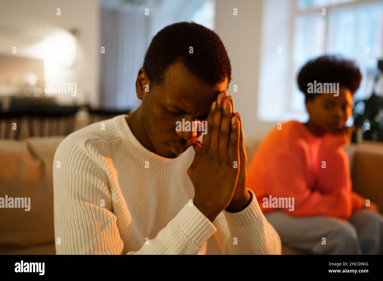 Depressed African American Man Think Of Divorce Not Looking At Wife