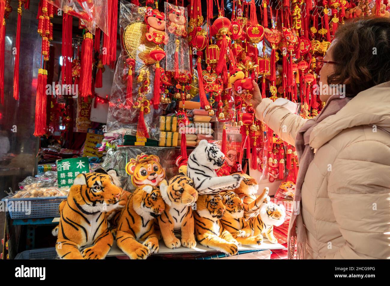 SHANGHAI, CHINA - DECEMBER 29, 2021 - Citizens buy various festive ...