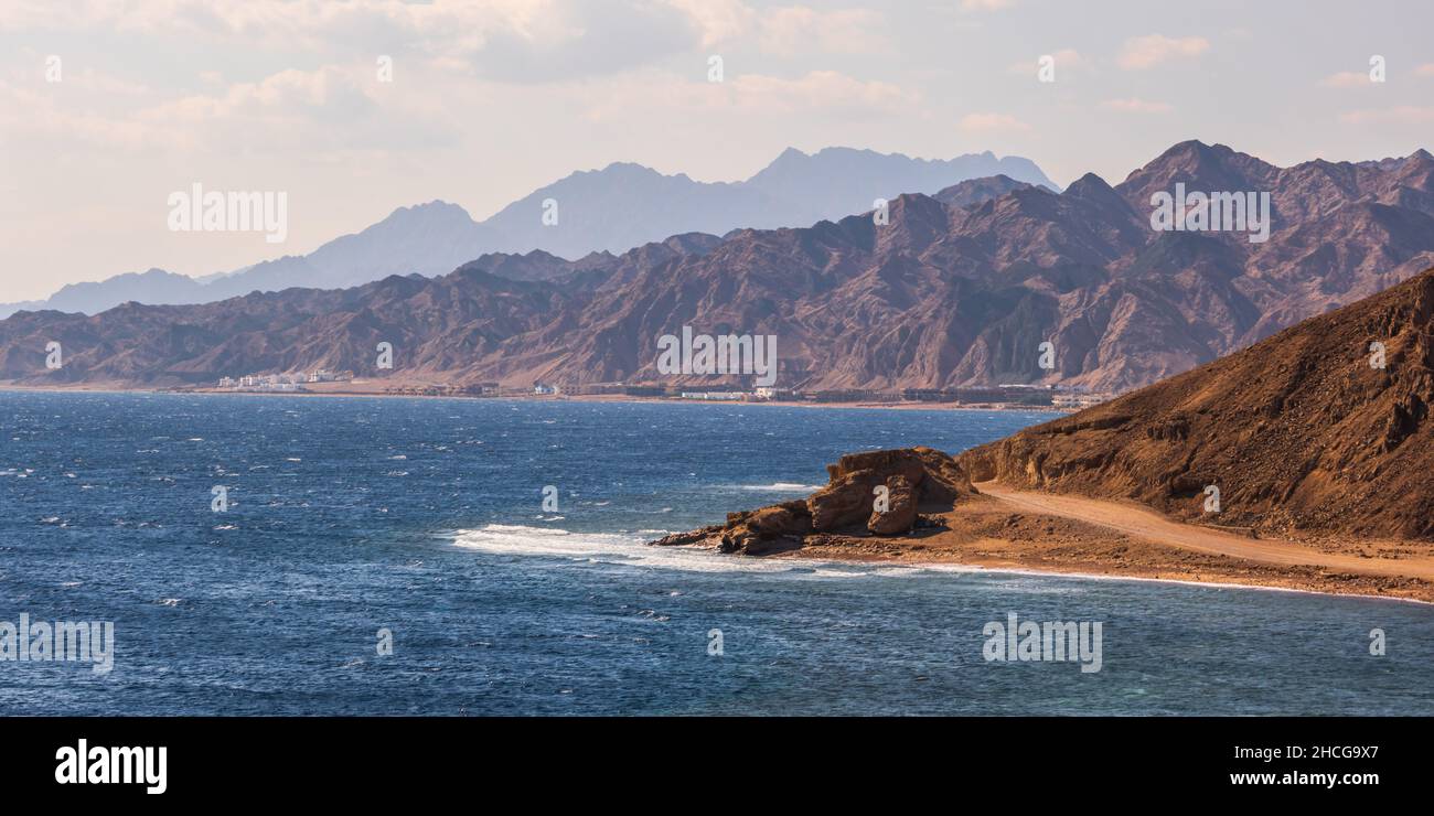 panorama view from the height of the mountains range to the blue sea ...