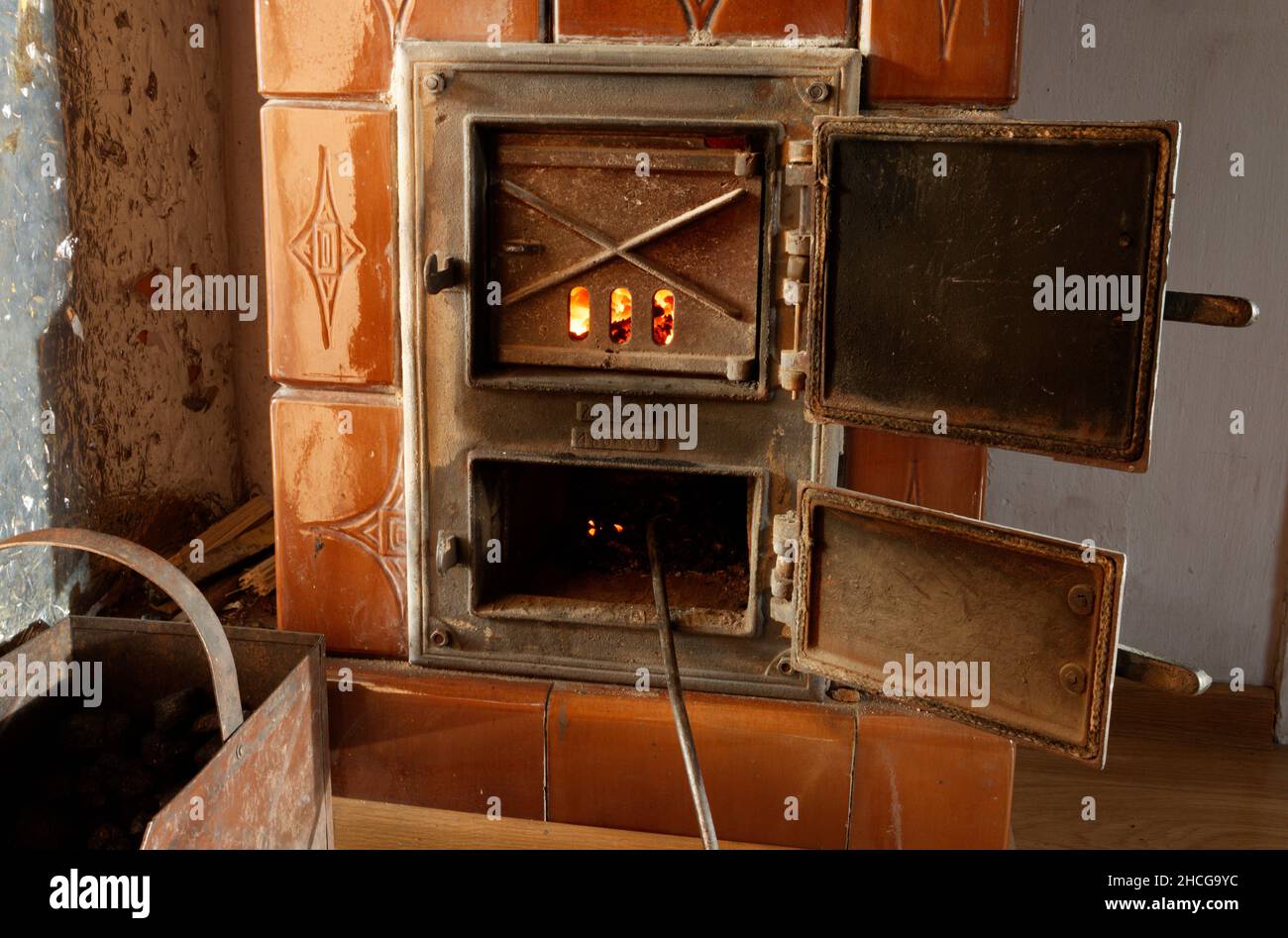 Traditional coal-fired heating furnace with decorative doors Stock ...