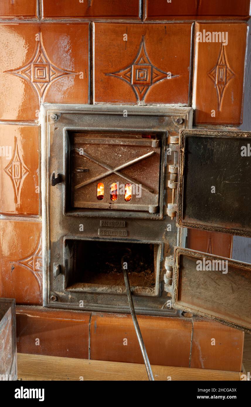 Traditional coal-fired heating furnace with decorative doors Stock ...