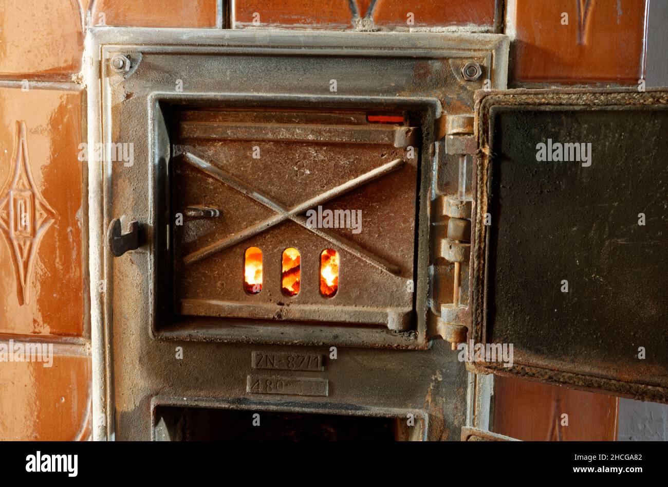 Traditional coal-fired heating furnace with decorative doors Stock ...