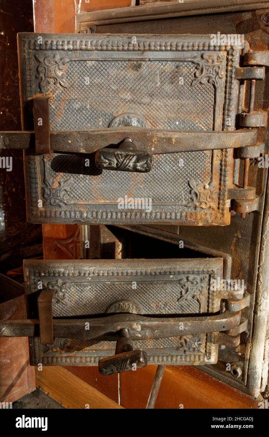 Traditional coal-fired heating furnace with decorative doors Stock ...