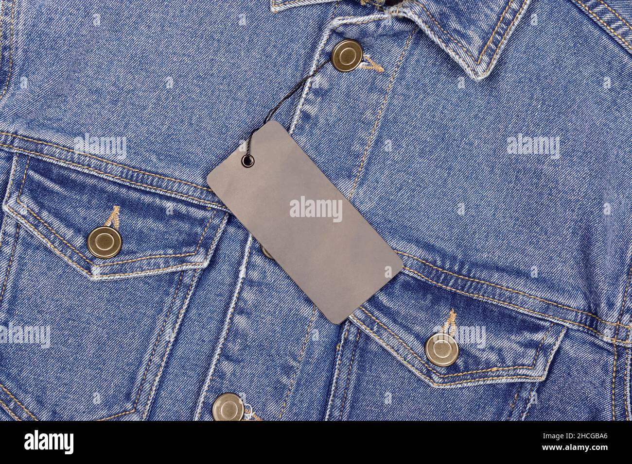 Top view of Black Tag on Denim Jacket Stock Photo - Alamy