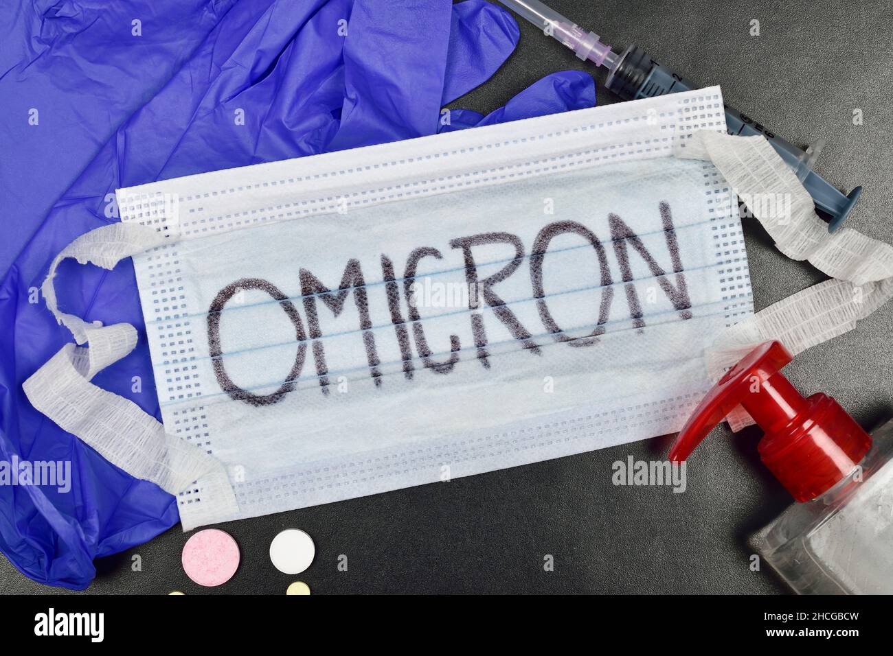 Omicron Face Mask with Sanitizer and Tablets Stock Photo - Alamy