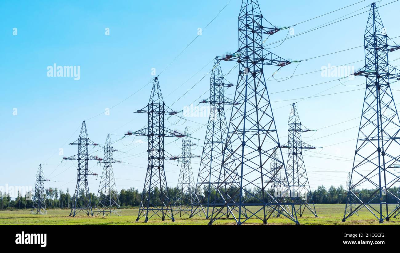 High voltage electric transmission towers. Overhead power lines on the ...