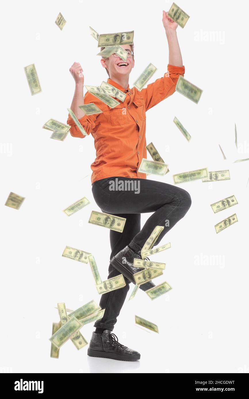 Happy young man enjoying rain of money, isolated on white Stock Photo ...