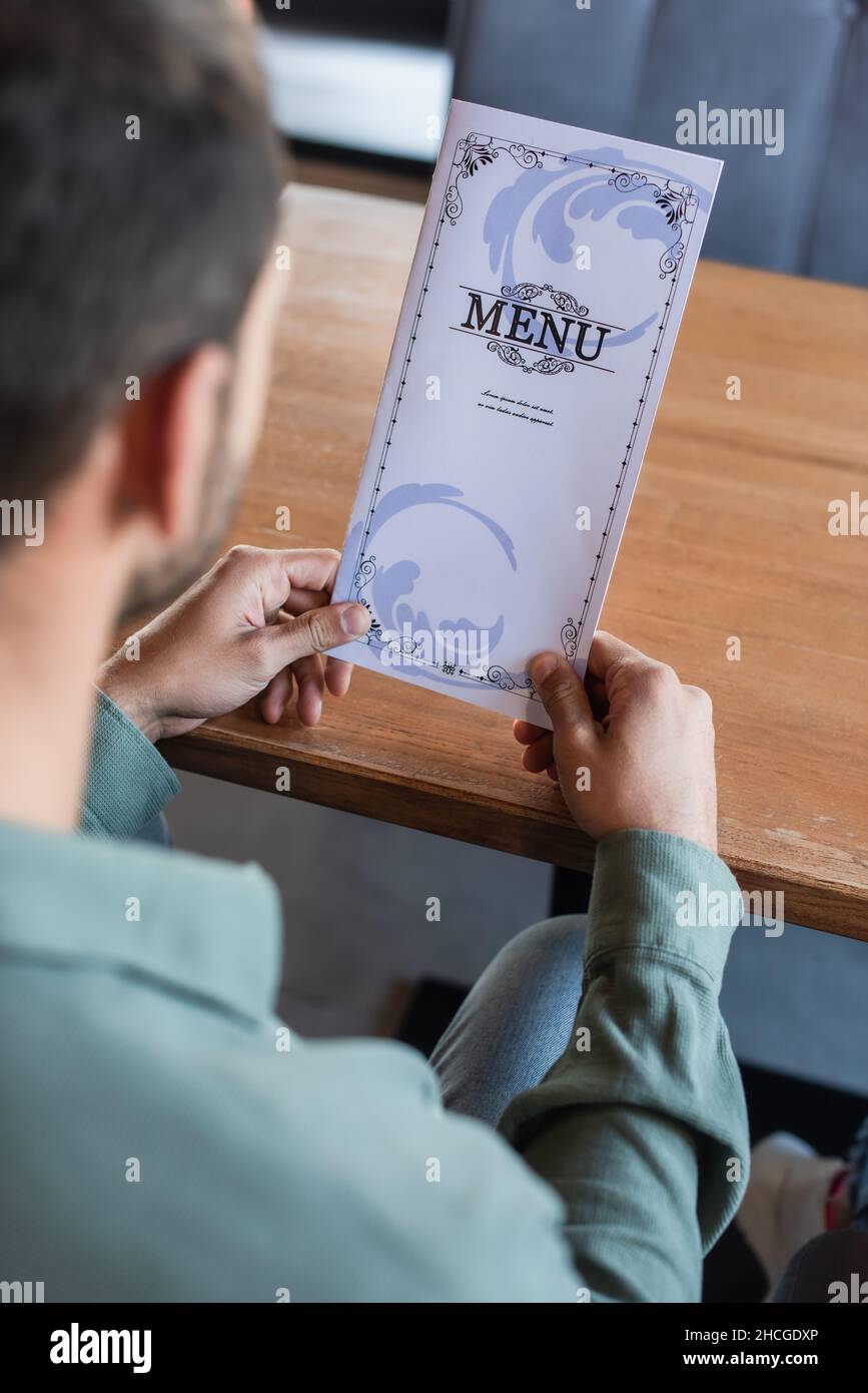 Man holding menu hi-res stock photography and images - Alamy