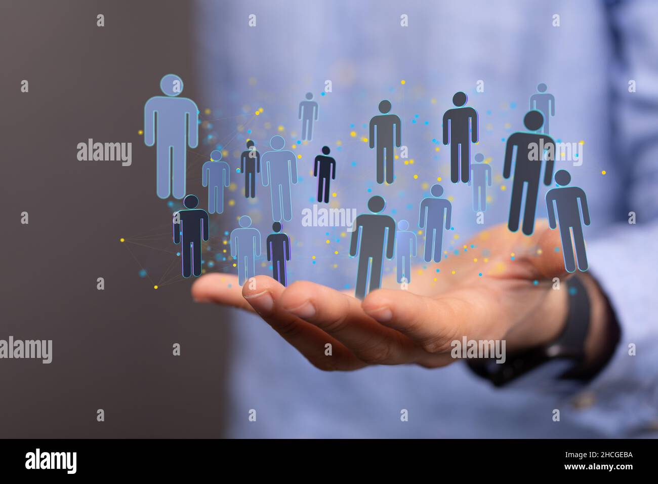 Closeup of the hand holding the digital human figures Stock Photo - Alamy