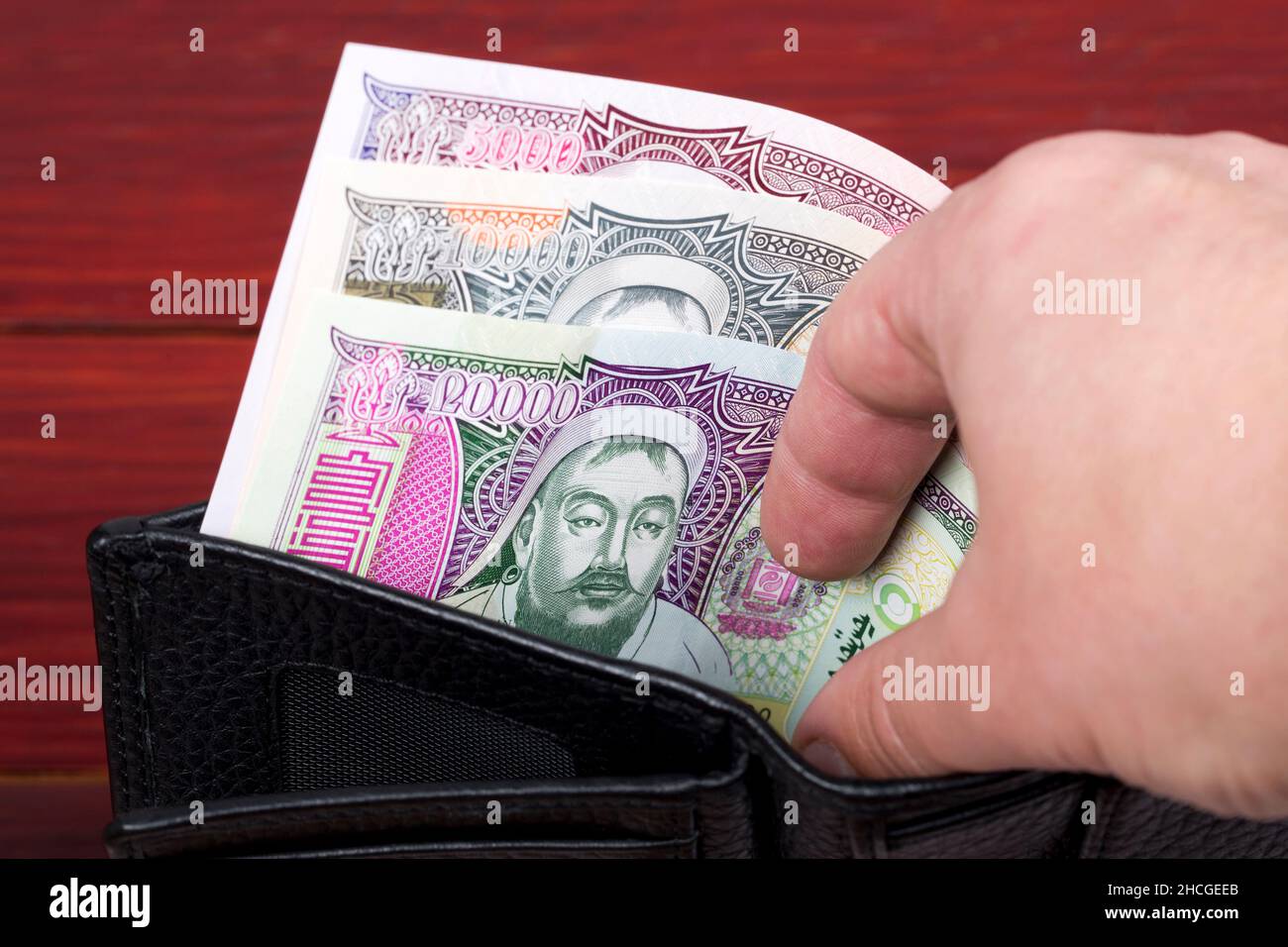 Mongolian money - Tugrik in the black wallet Stock Photo - Alamy