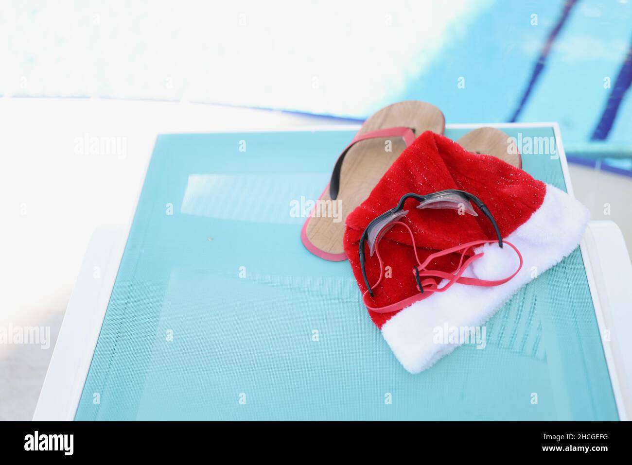 Santa Claus hat and accessories for swimming in the pool Stock Photo ...