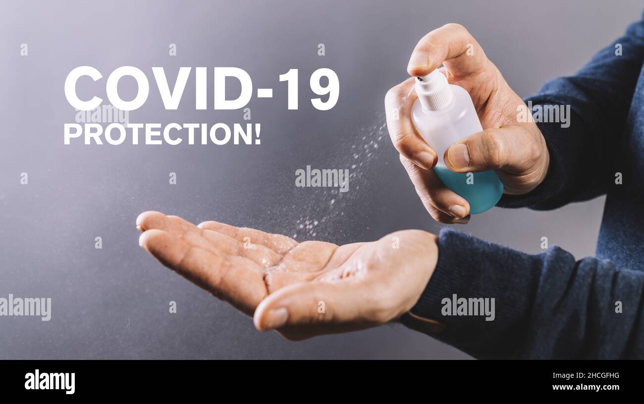 men use alcohol spray to spray hands to get rid of bacteria and COVID ...