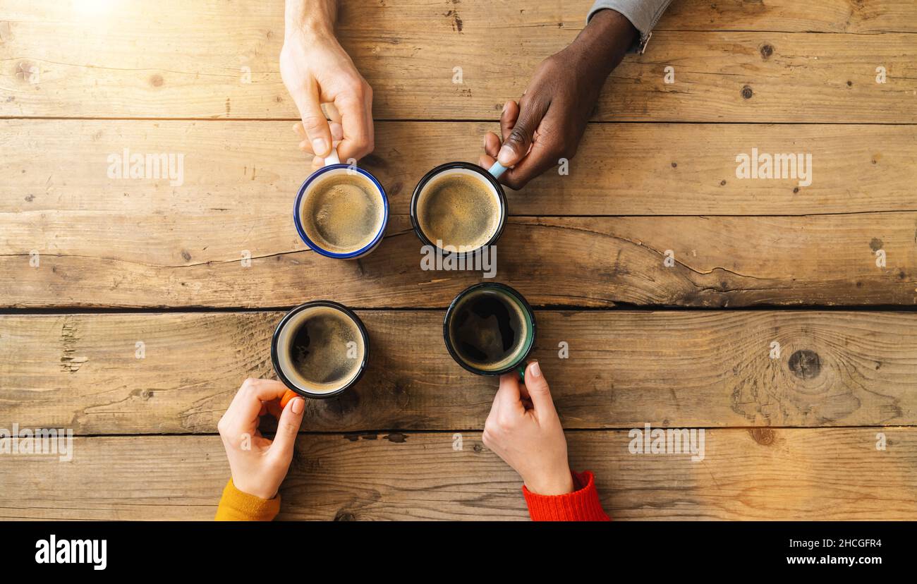 Friends group drinking coffee in a bar restaurant - People hands ...