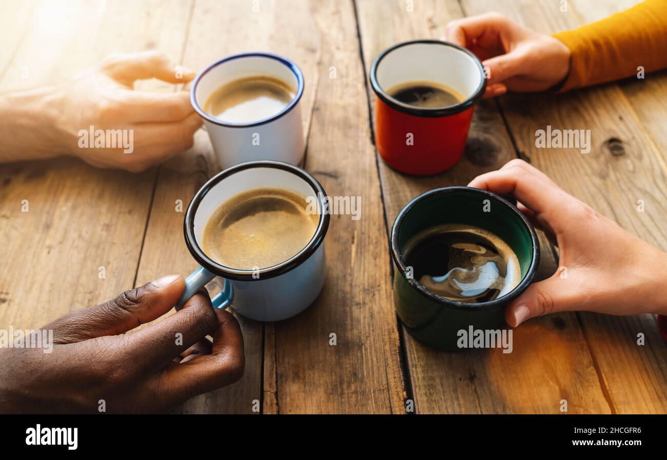 Friends group drinking cappuccino at coffee in a bar restaurant ...