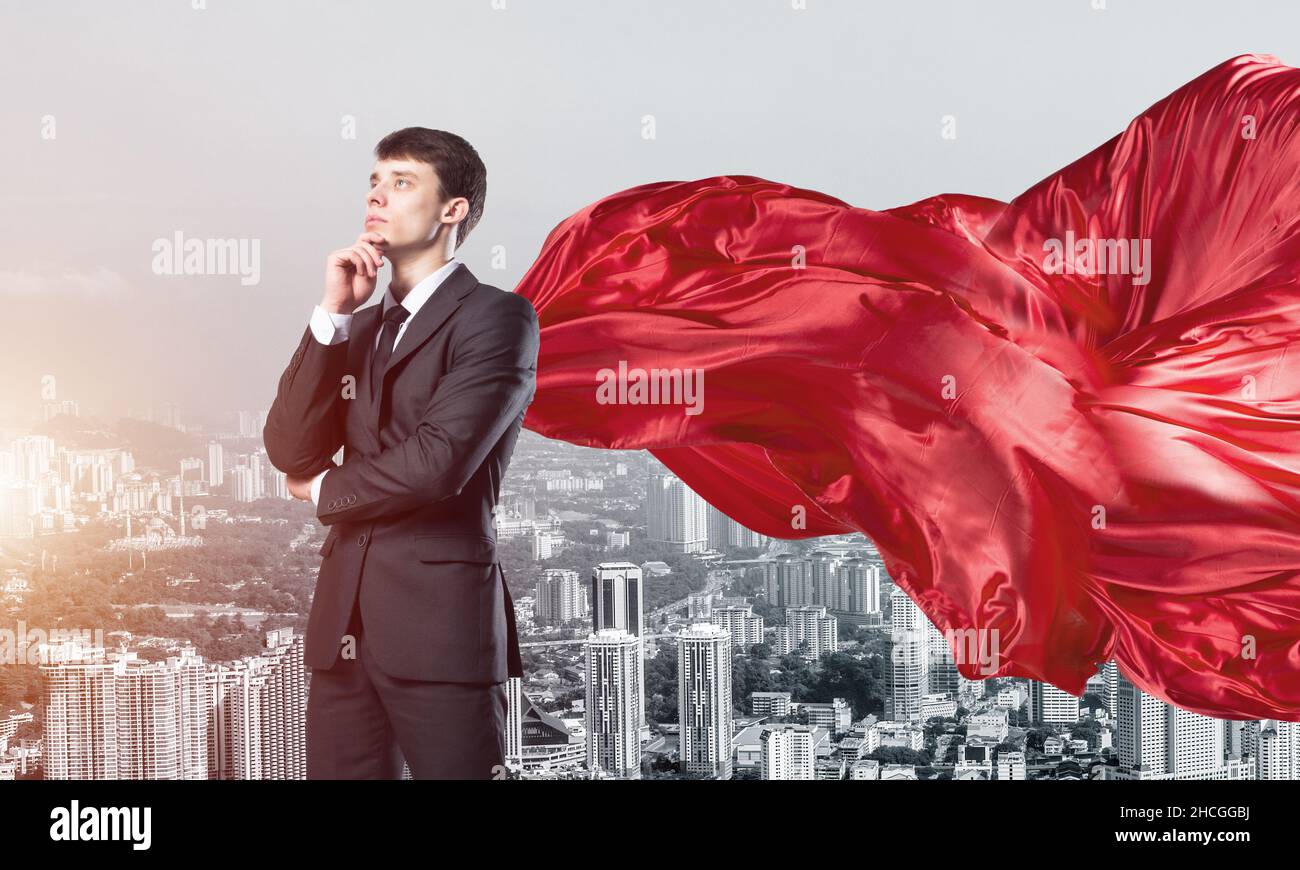 Concept of power and sucess with businessman superhero in big city ...