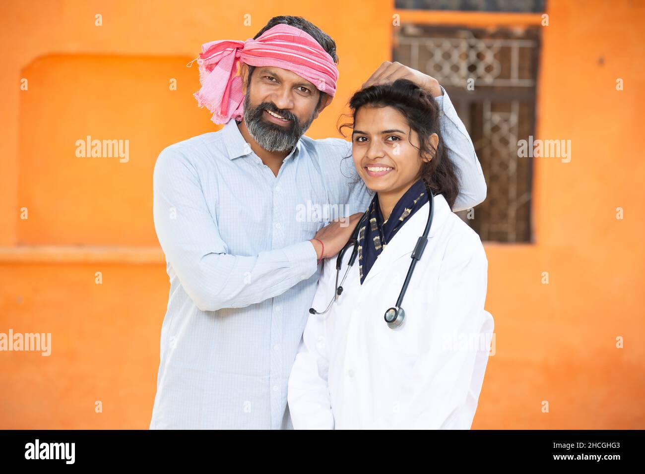 Portrait of happy Indian farmer father support his young daughter ...
