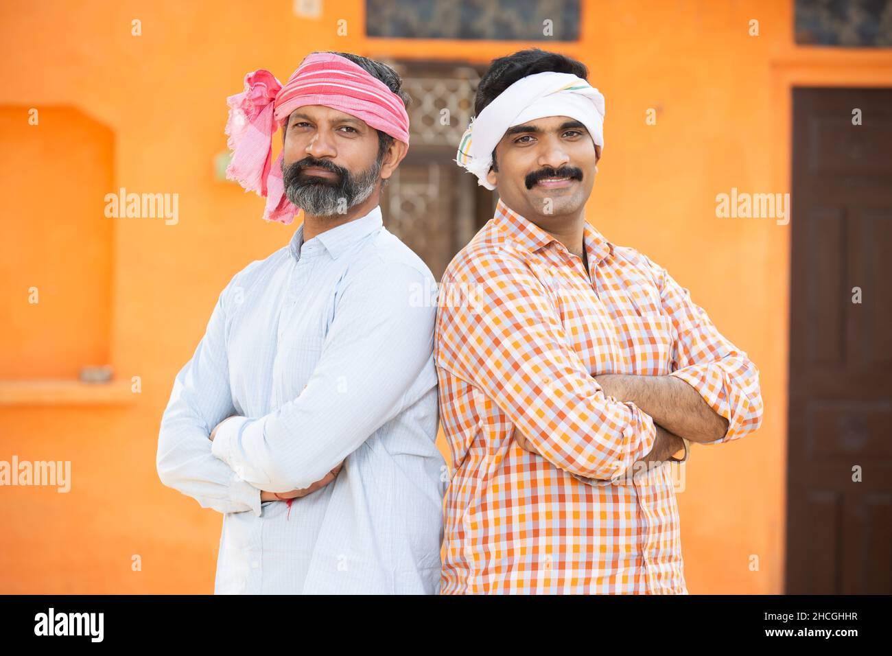 Portrait of Two happy indian farmer with mustache and beard standing ...
