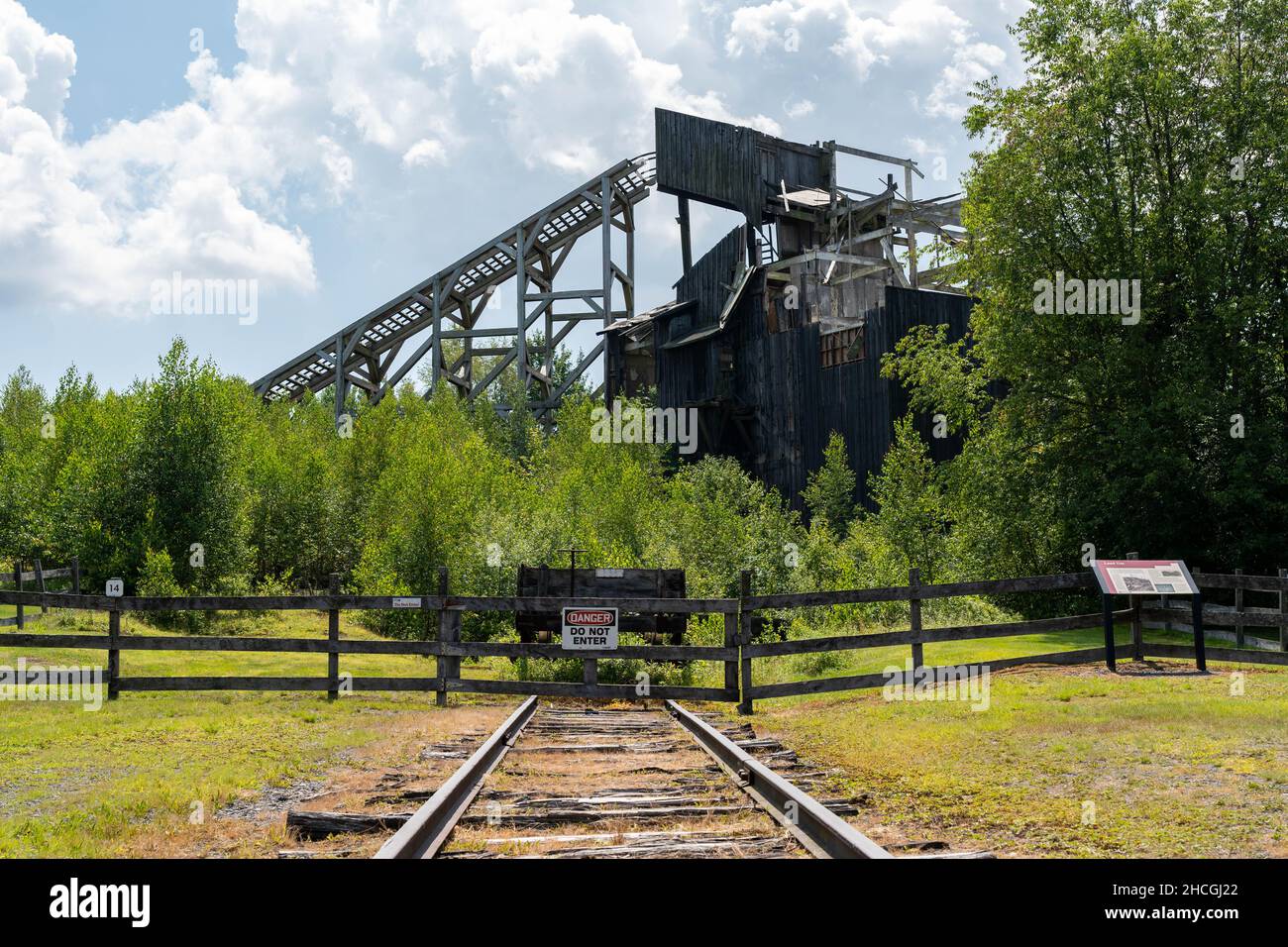 A historic coal breaker with a dilapidated railroad tracks in the ...