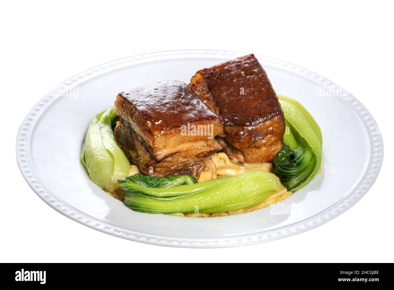 Dong Po Rou (Dongpo pork meat) in a plate with green vegetable isolated ...