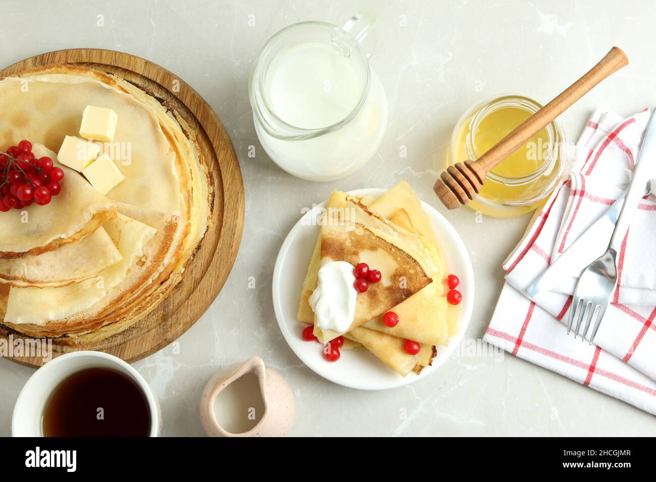 Concept of tasty food with crepes on light background Stock Photo - Alamy