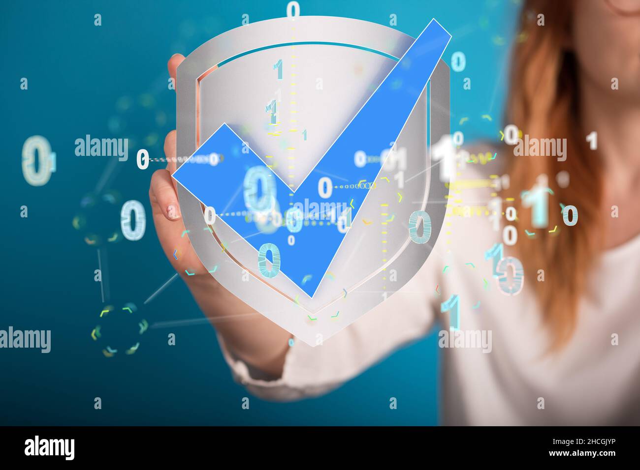 Woman's hand touching the 3d rendered shield with a checkmark and binary numbers. Cybersecurity ...