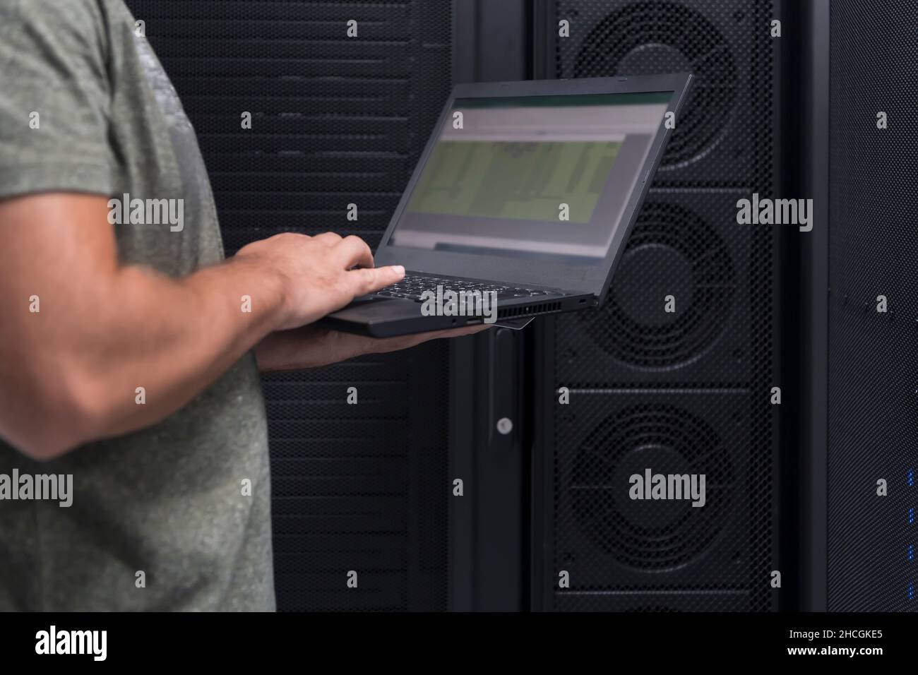 Data Center Engineer Using Laptop Computer. Server Room Specialist ...