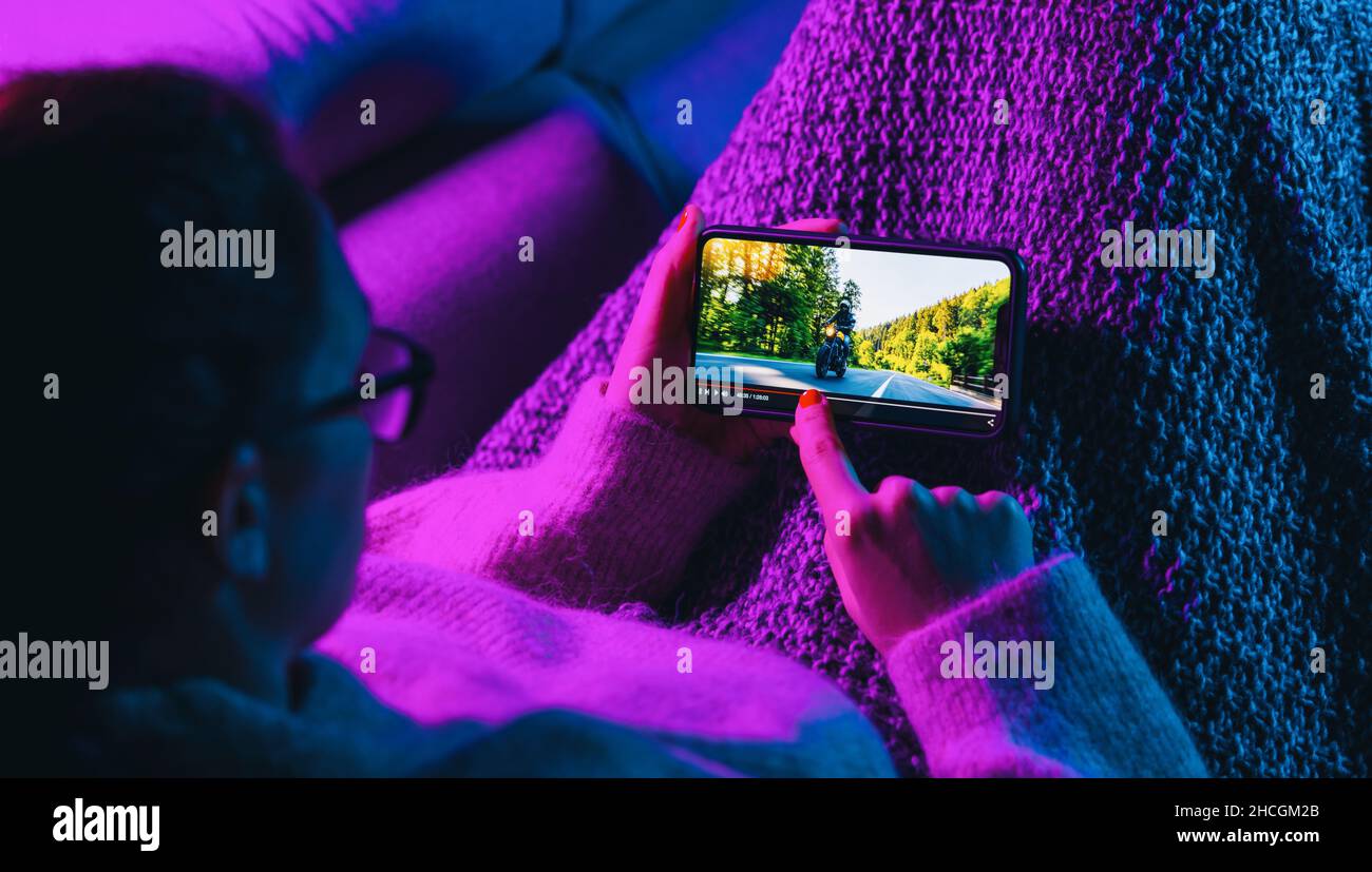 Woman stop watching film on mobile phone with imaginary video player ...