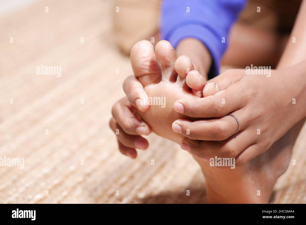 Close up on young man suffering feet pain Stock Photo - Alamy