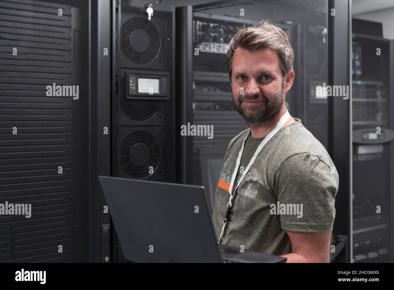 Data Center Engineer Using Laptop Computer Server Room Specialist ...