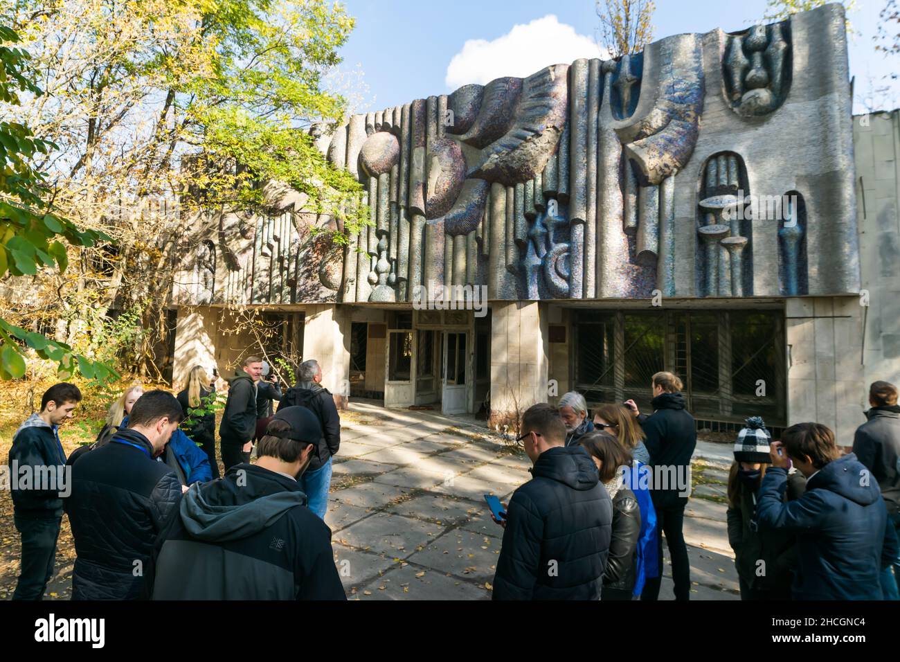 Chernobyltour group stands in front of old Pripyet cinema building ...
