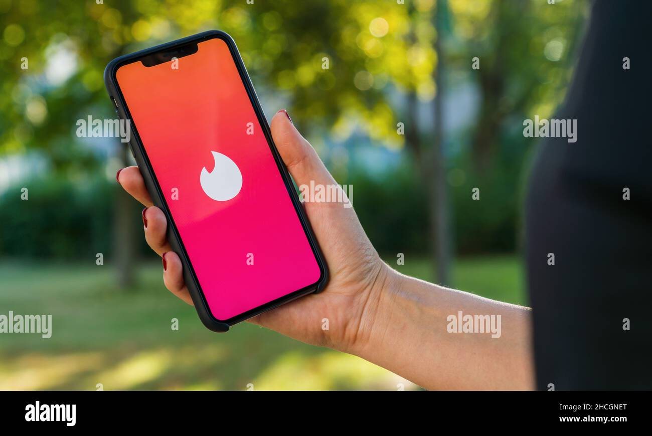 Woman hand holding iphone Xs with logo of LinkedIn application on the ...