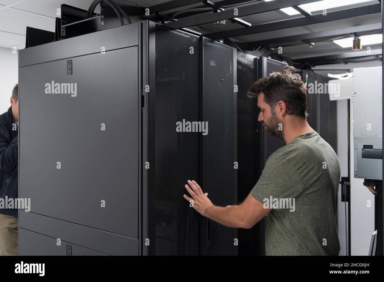Technicians team updating hardware inspecting system performance in ...