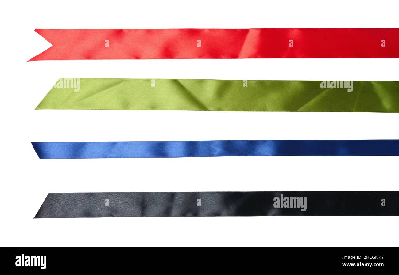 set of multicolored silk ribbons on abel background. View from above ...
