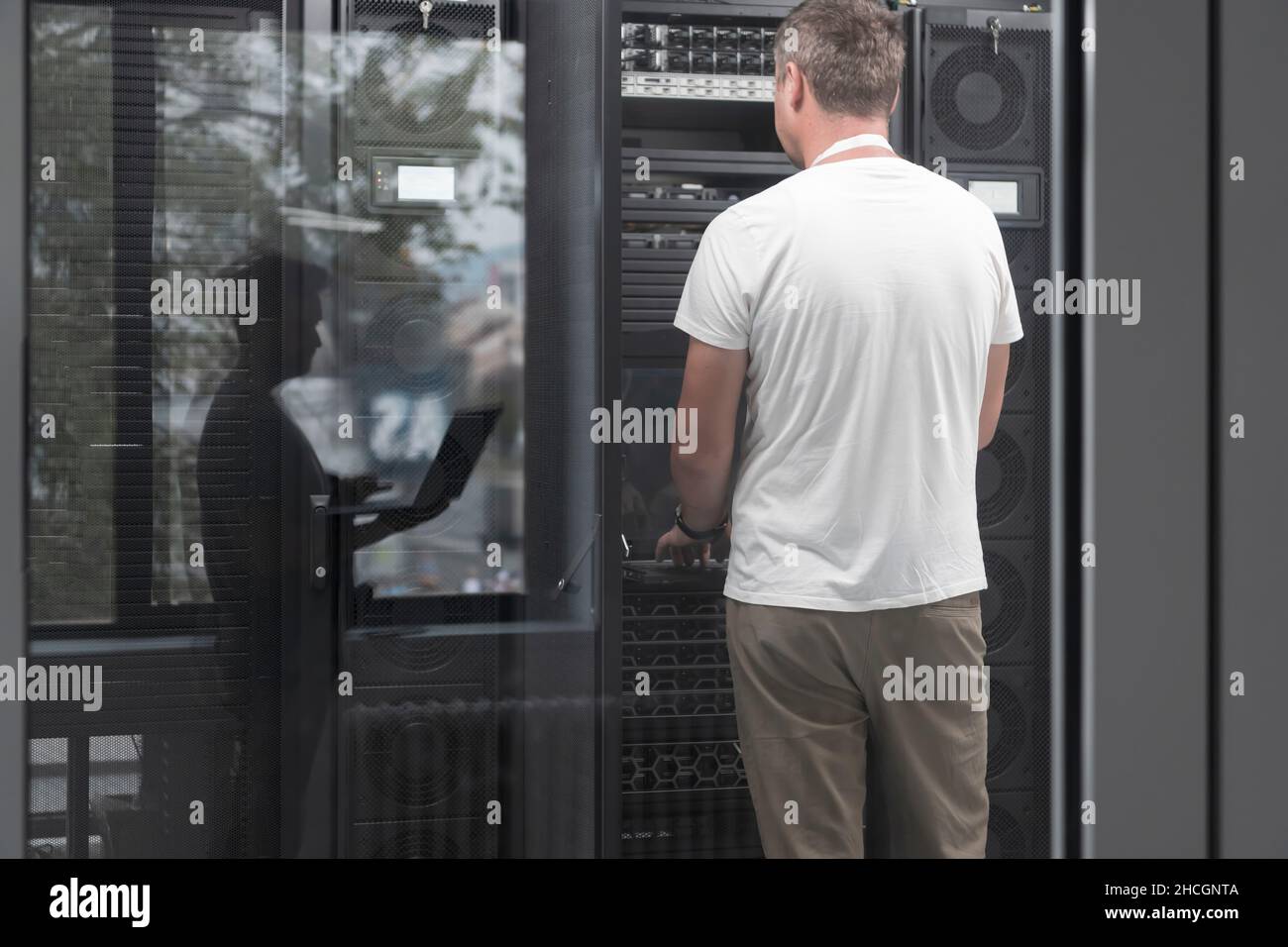 Technicians team updating hardware inspecting system performance in ...