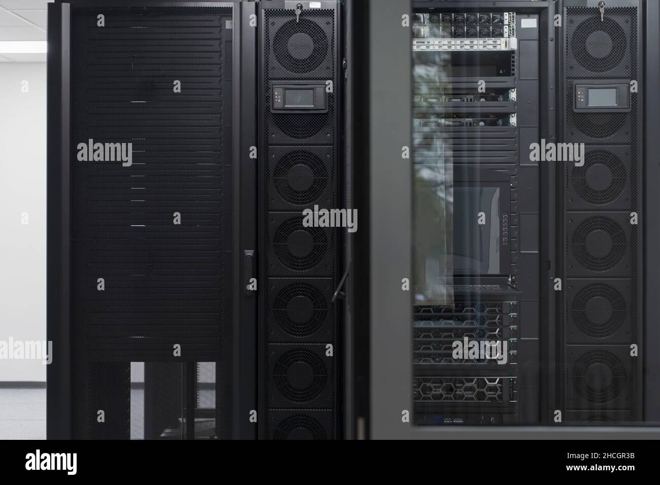 Data Center With Multiple Rows of Fully Operational Server Racks. Modern Telecommunications ...
