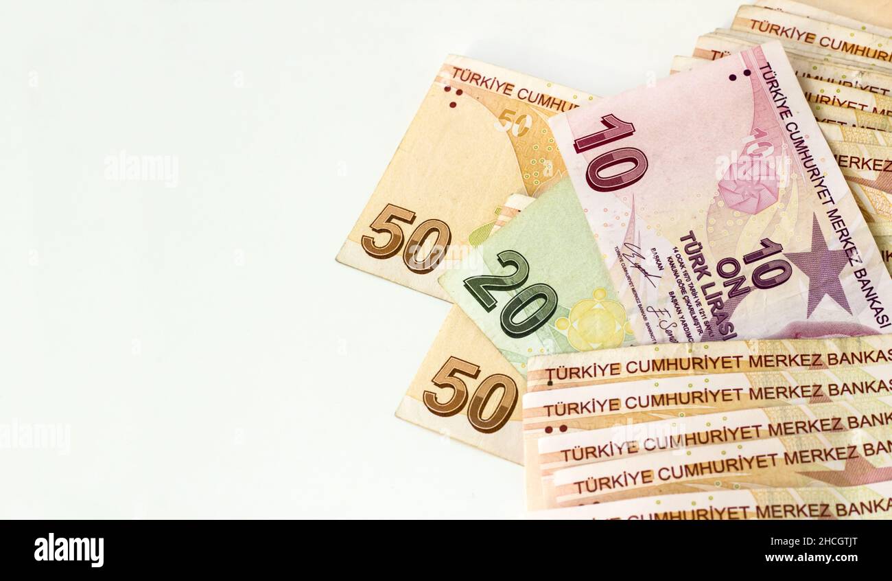 Turkish fifty,twenty and ten lira banknotes on white surface with a ...