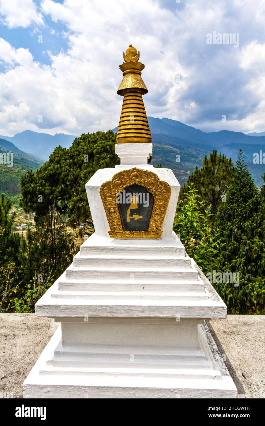 White stupa next to the Khamsum Yuelley Namgyal Chorten, a temple ...