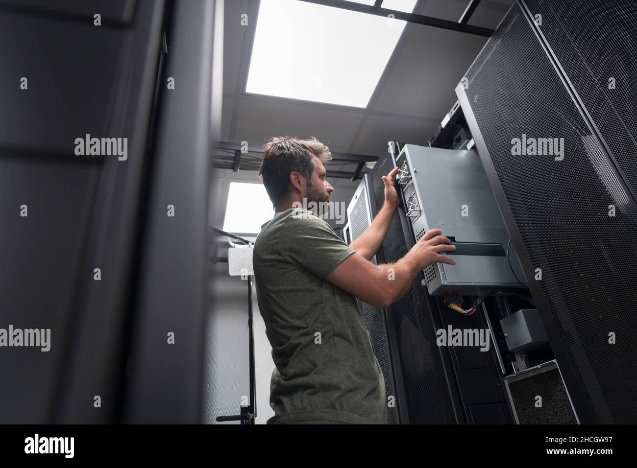 IT engineer working In the server room or data center The technician ...