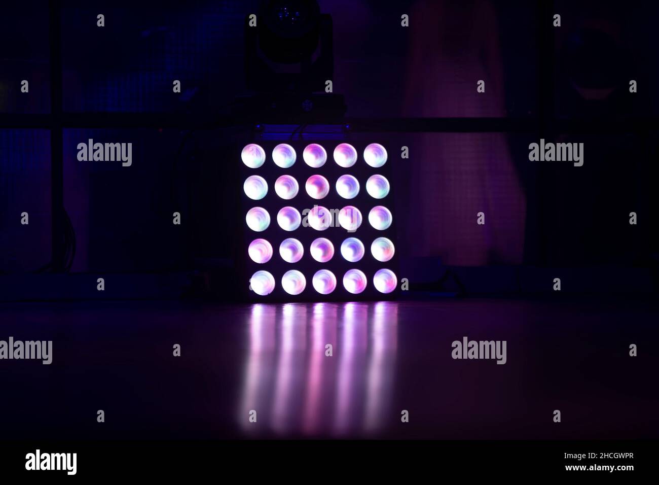 A stage lamp stands on the floor with a reflection Stock Photo - Alamy