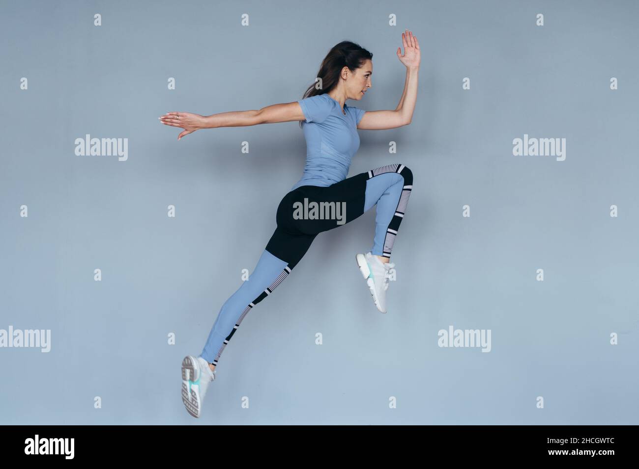 Fit woman exercising at home doing fitness workout Stock Photo - Alamy