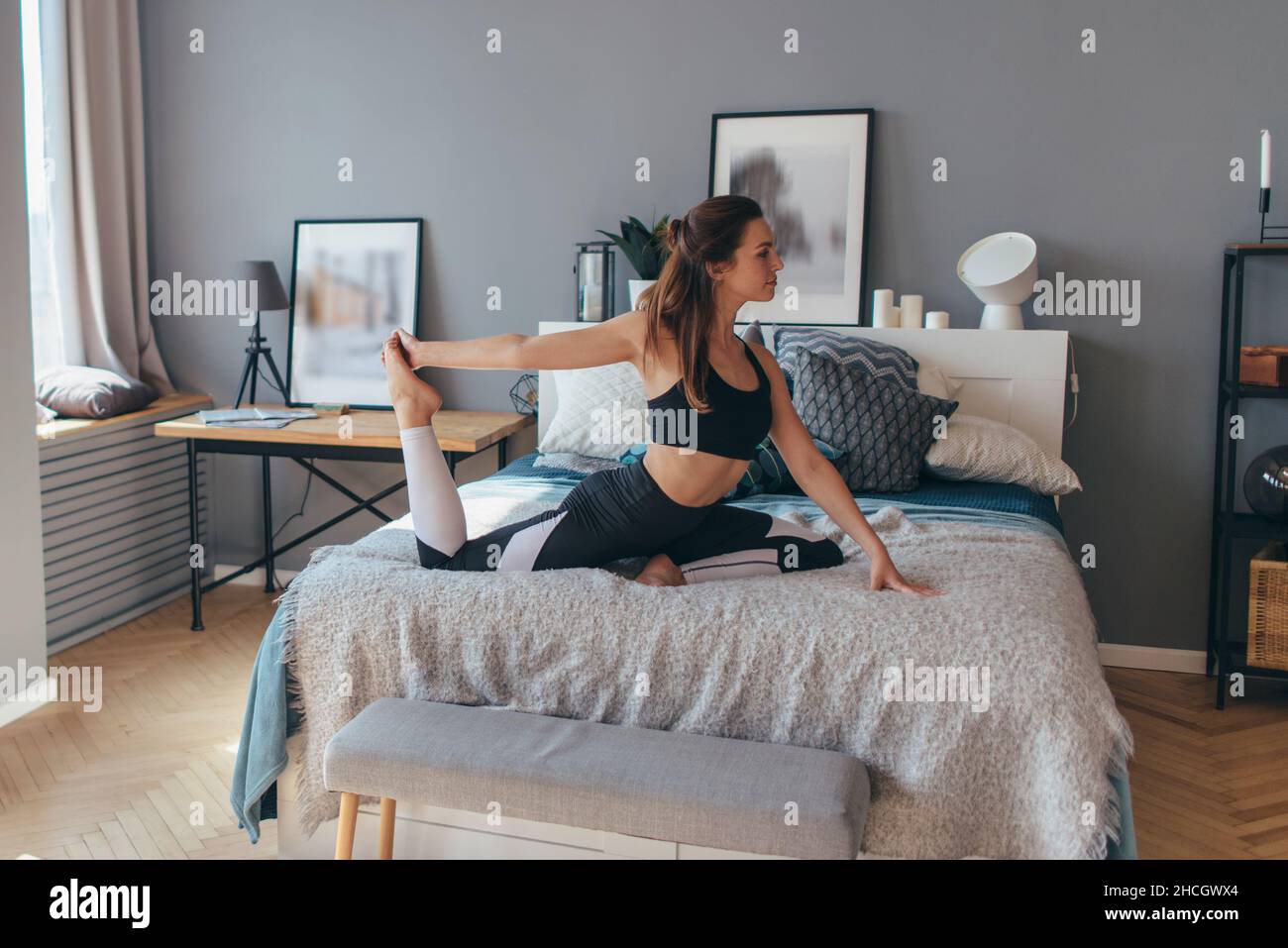 Woman gymnastics in bed hi-res stock photography and images - Alamy
