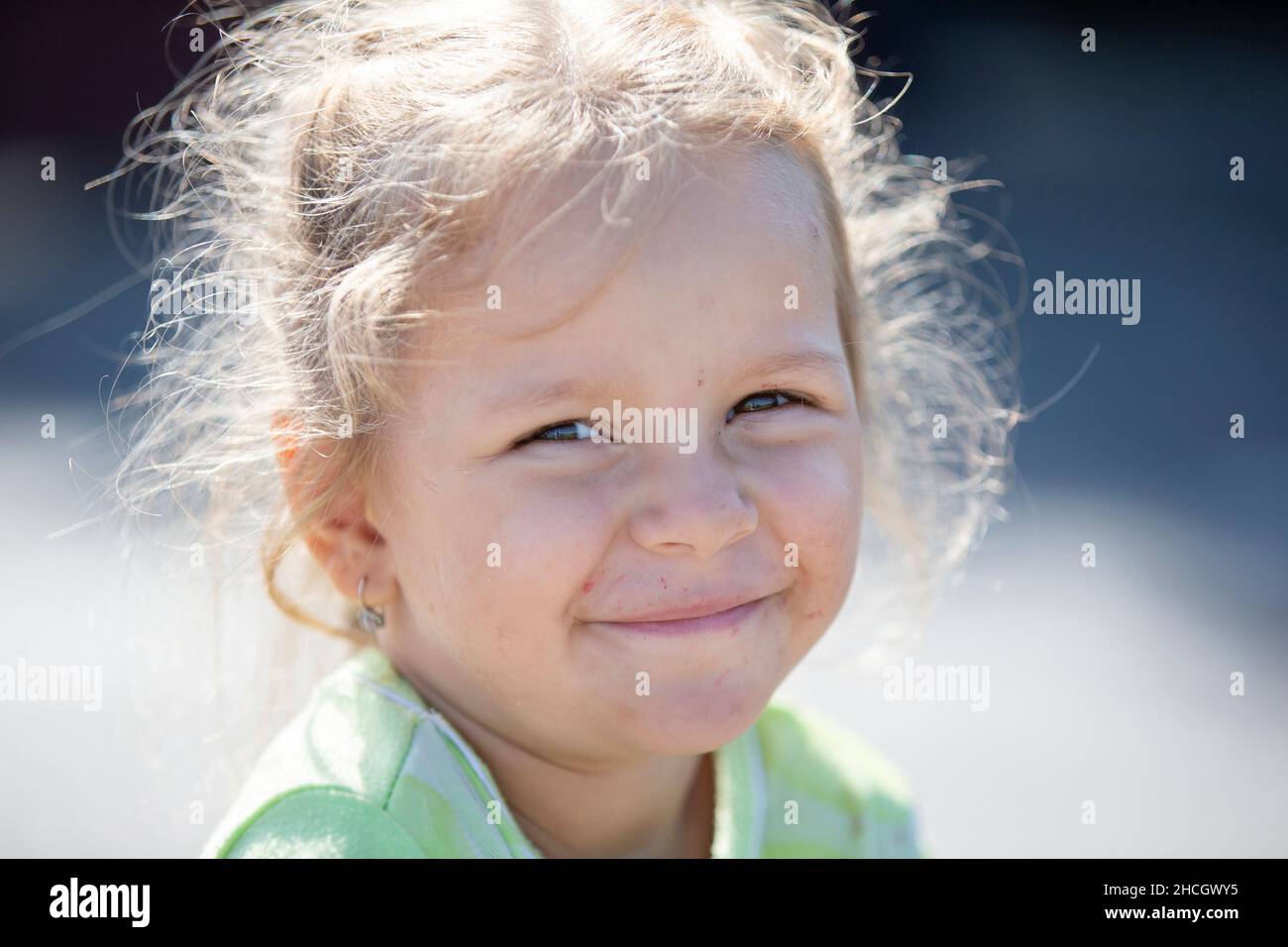 A funny girl with a dirty face looks at the camera and smiles Stock ...