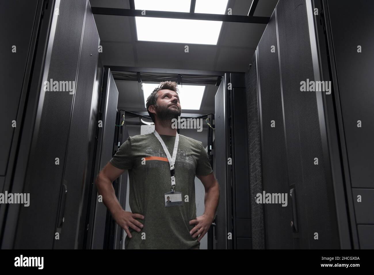 Portrait of male technician or network administrator standing brave as ...