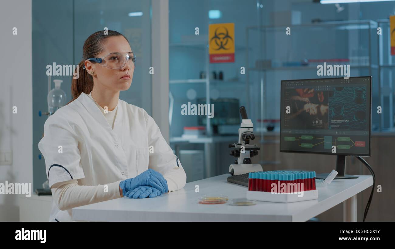 Lab worker using glasses with virtual reality to develop experiment ...