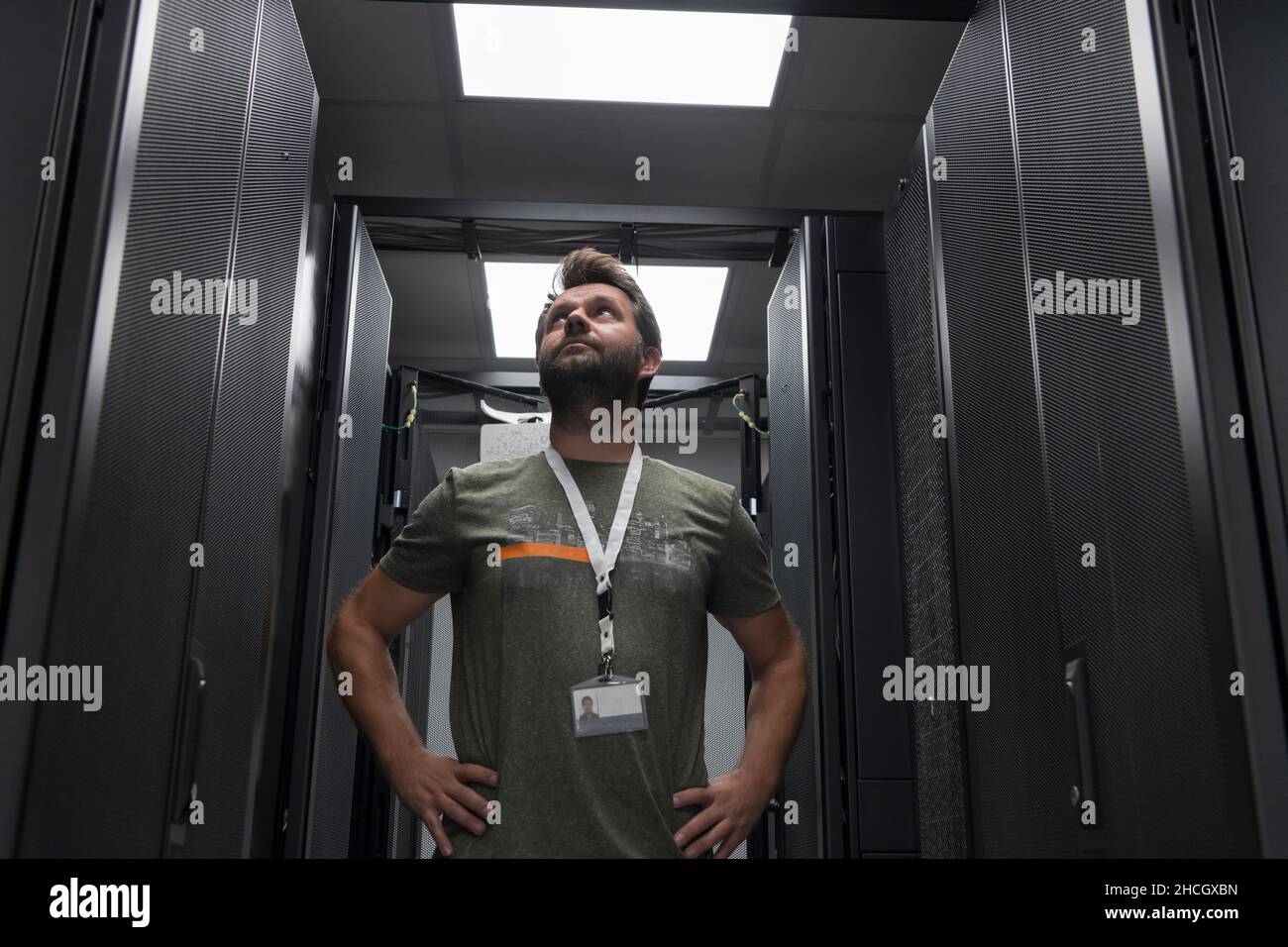 Portrait of male technician or network administrator standing brave as ...