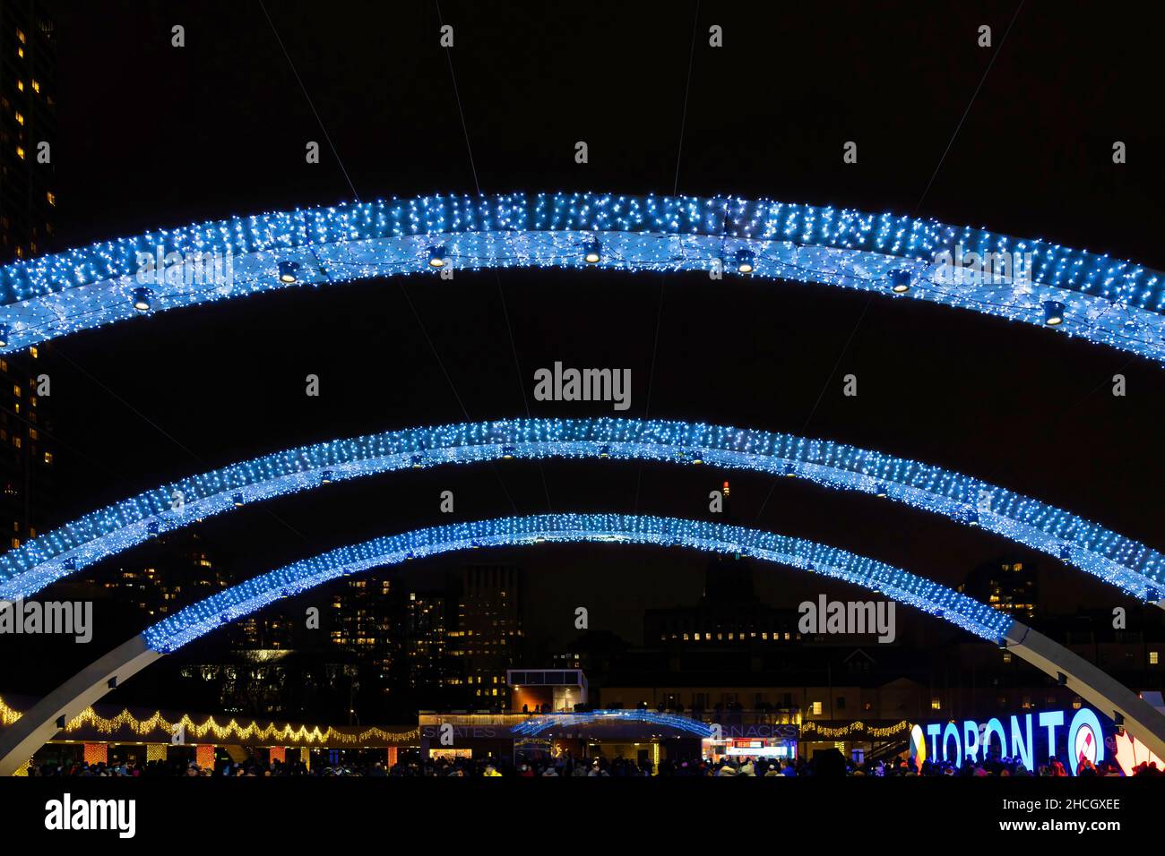 the 'Peace Arches' in the Nathan Phillips Square. They are illuminated ...