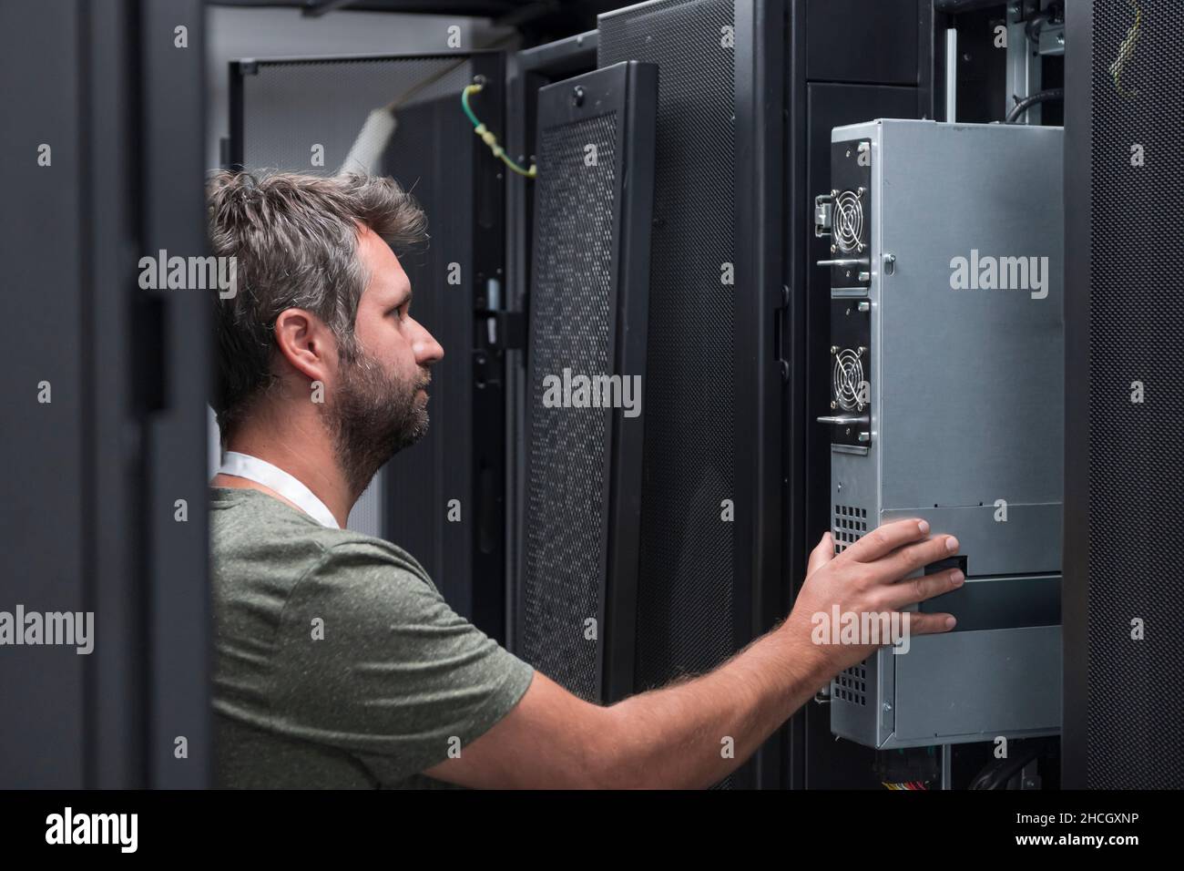 IT engineer working In the server room or data center The technician ...