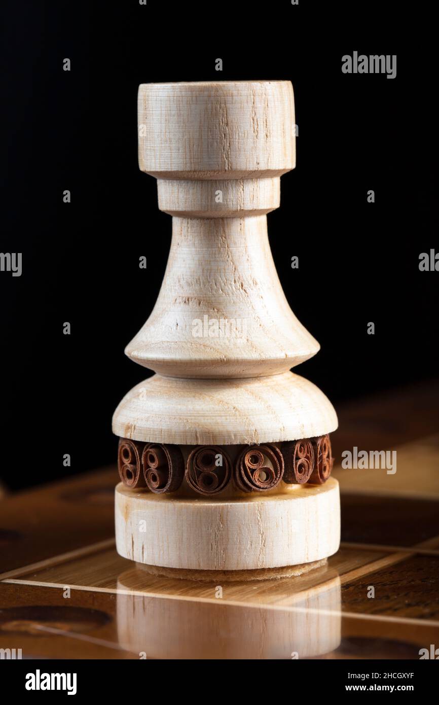 Chess white rook wooden piece. A puzzle game with tricky combinations ...